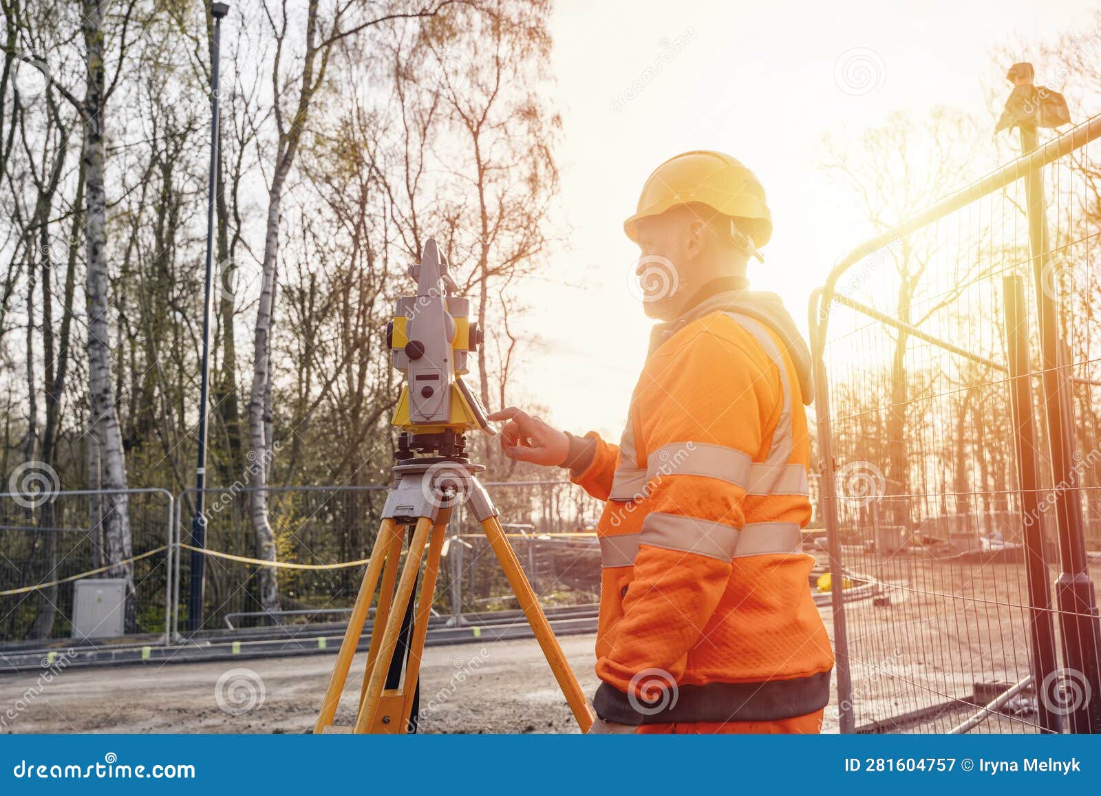 Site Engineer Setting His Instrument during Roadworks. Builder ...