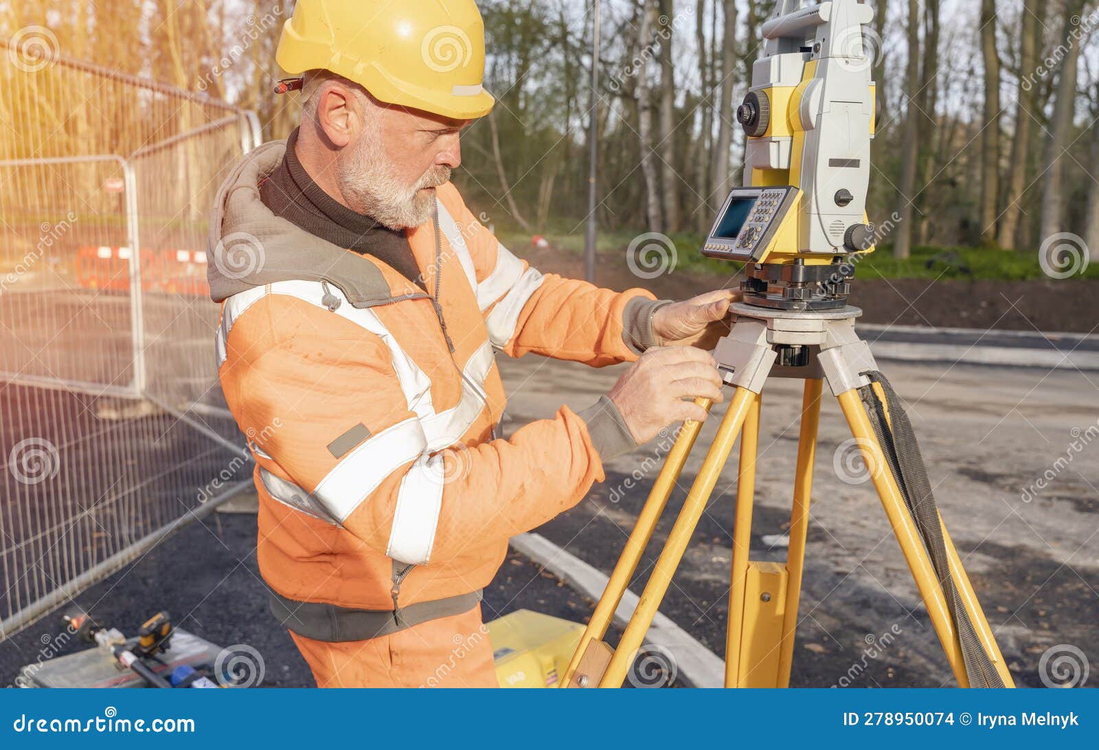 Site Engineer Setting His Instrument during Roadworks. Builder ...