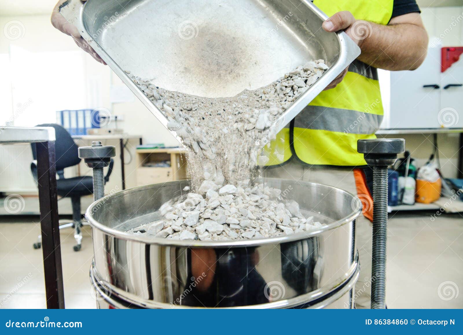 On Site Road Testing Laboratory. Placing Sample of Gravel into a Stock ...