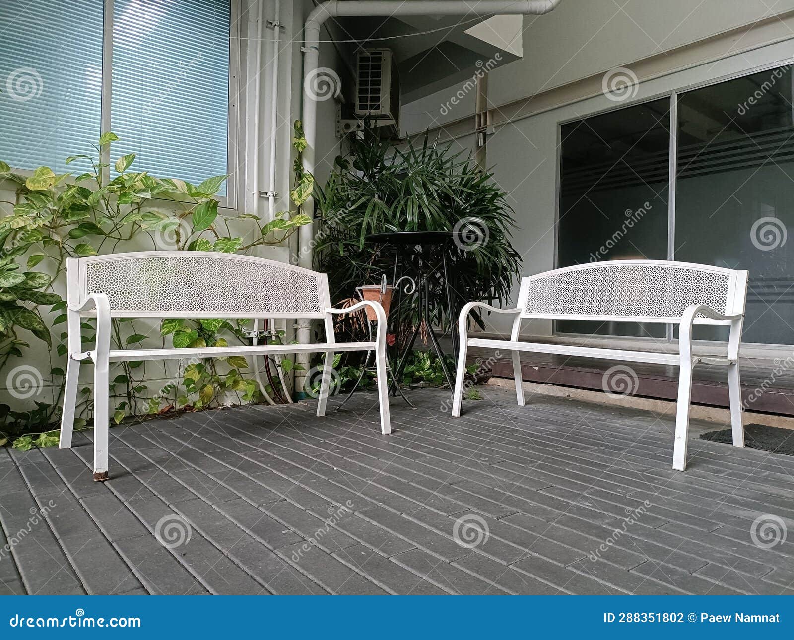 The Sitting Area Has 2 Benches. Stock Photo - Image of males, adult ...
