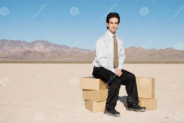 Sitting on boxes stock photo. Image of serious, decision - 5728384