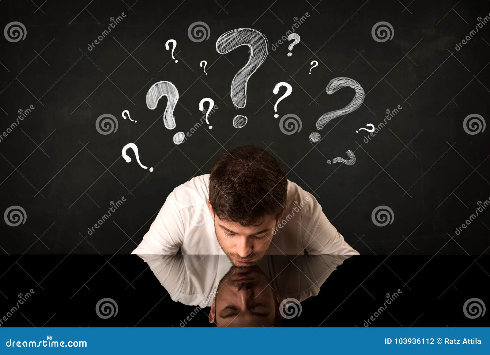 Sitting Businessman Under Question Marks Stock Photo - Image of ...