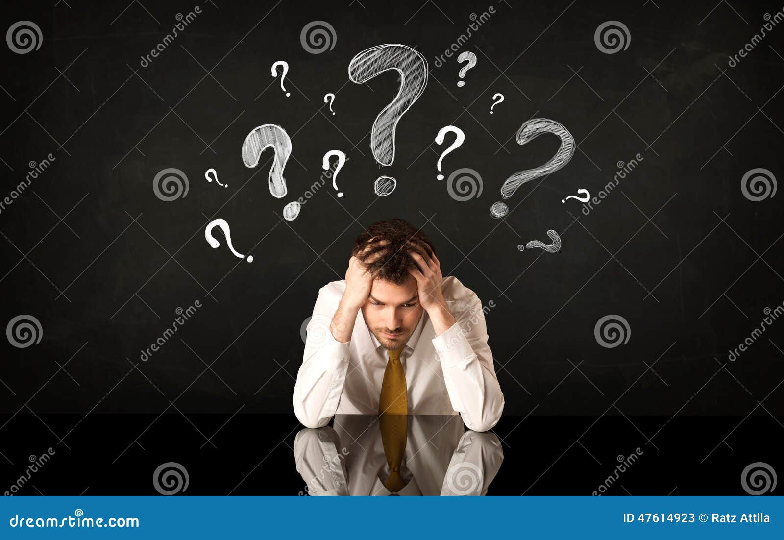 Sitting Businessman Under Question Marks Stock Image - Image of ...