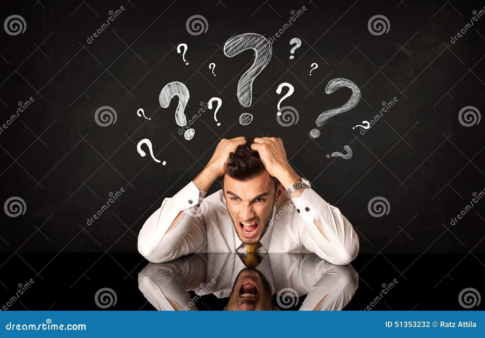 Sitting Businessman Under Question Marks Stock Photo - Image of ...