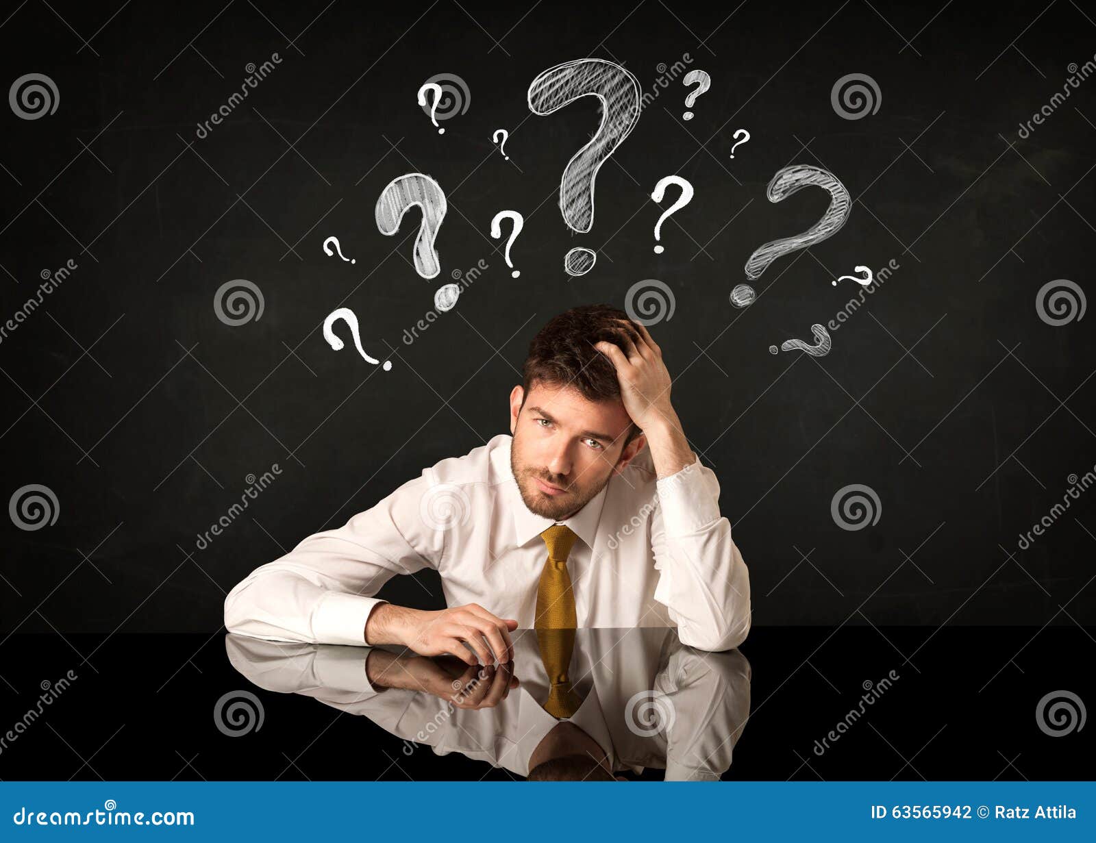 Sitting Businessman Under Question Marks Stock Photo - Image of ...