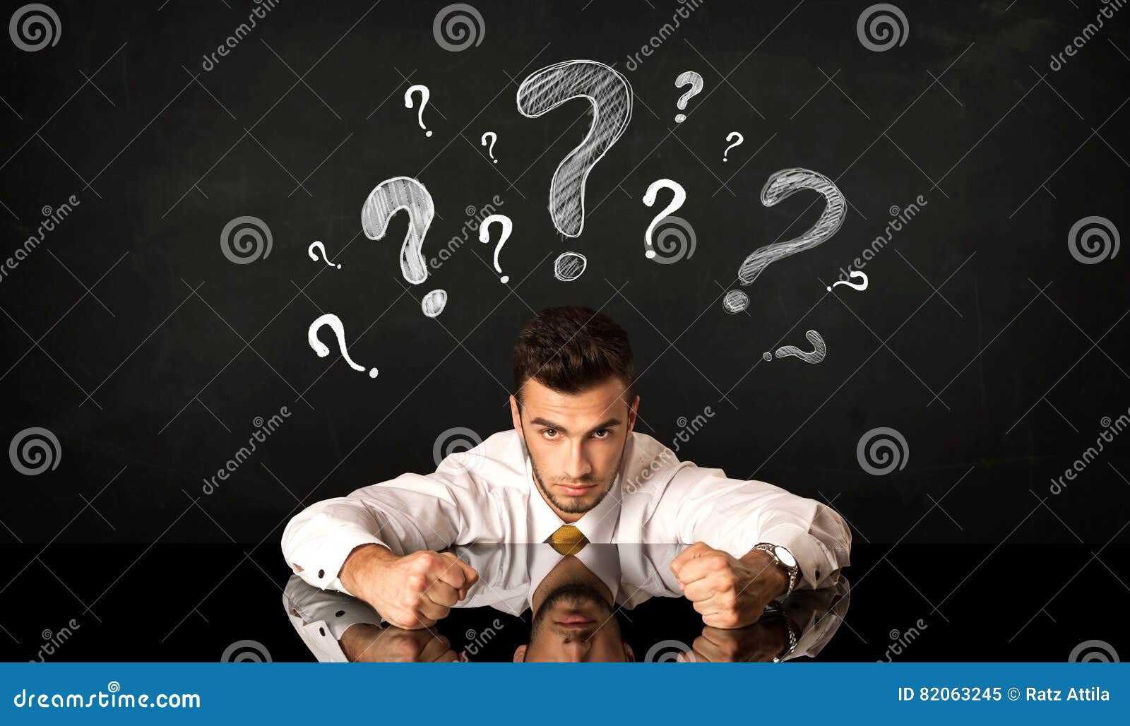 Sitting Businessman Under Question Marks Stock Image - Image of ...