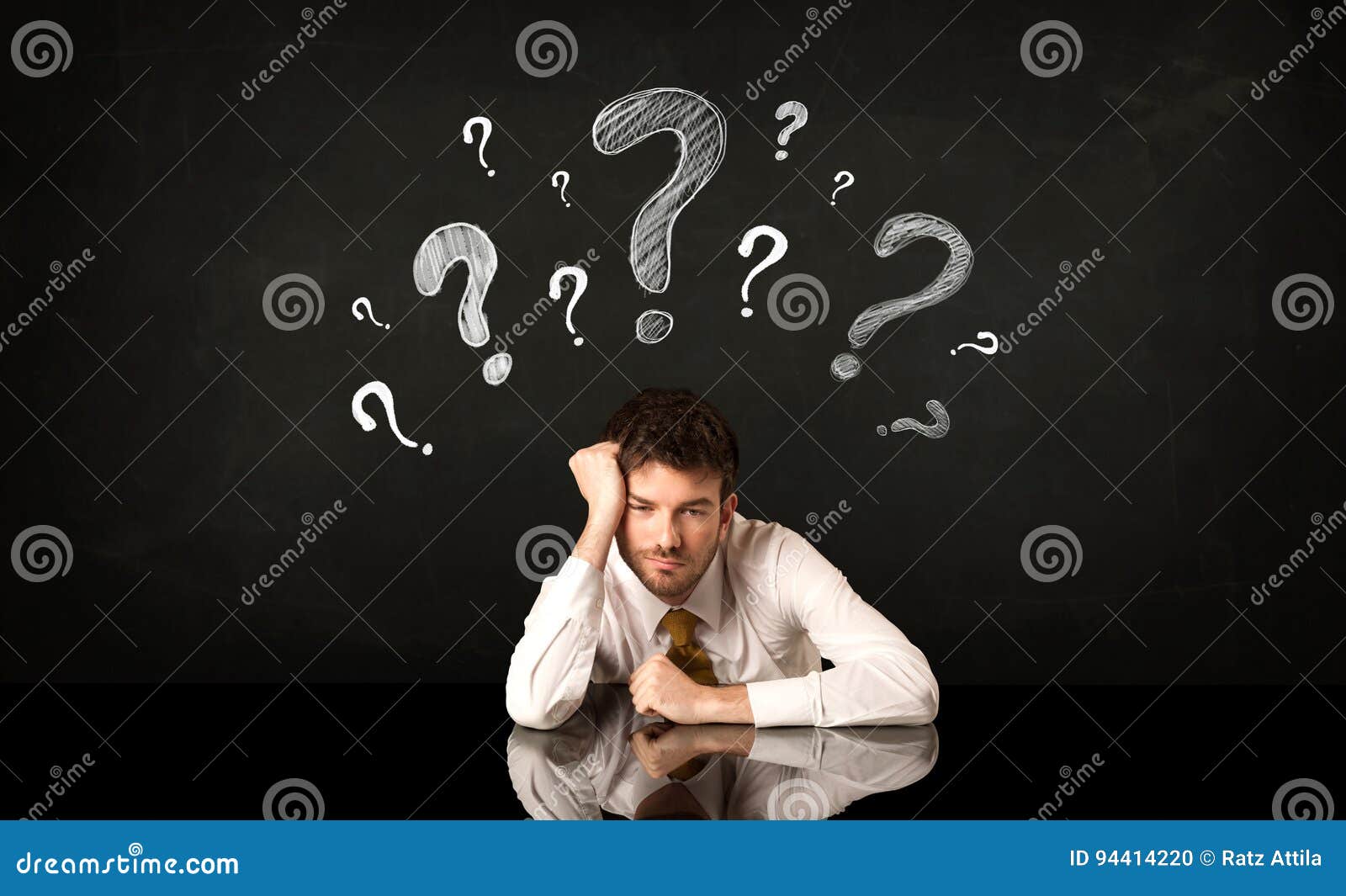 Sitting Businessman Under Question Marks Stock Photo - Image of mind ...