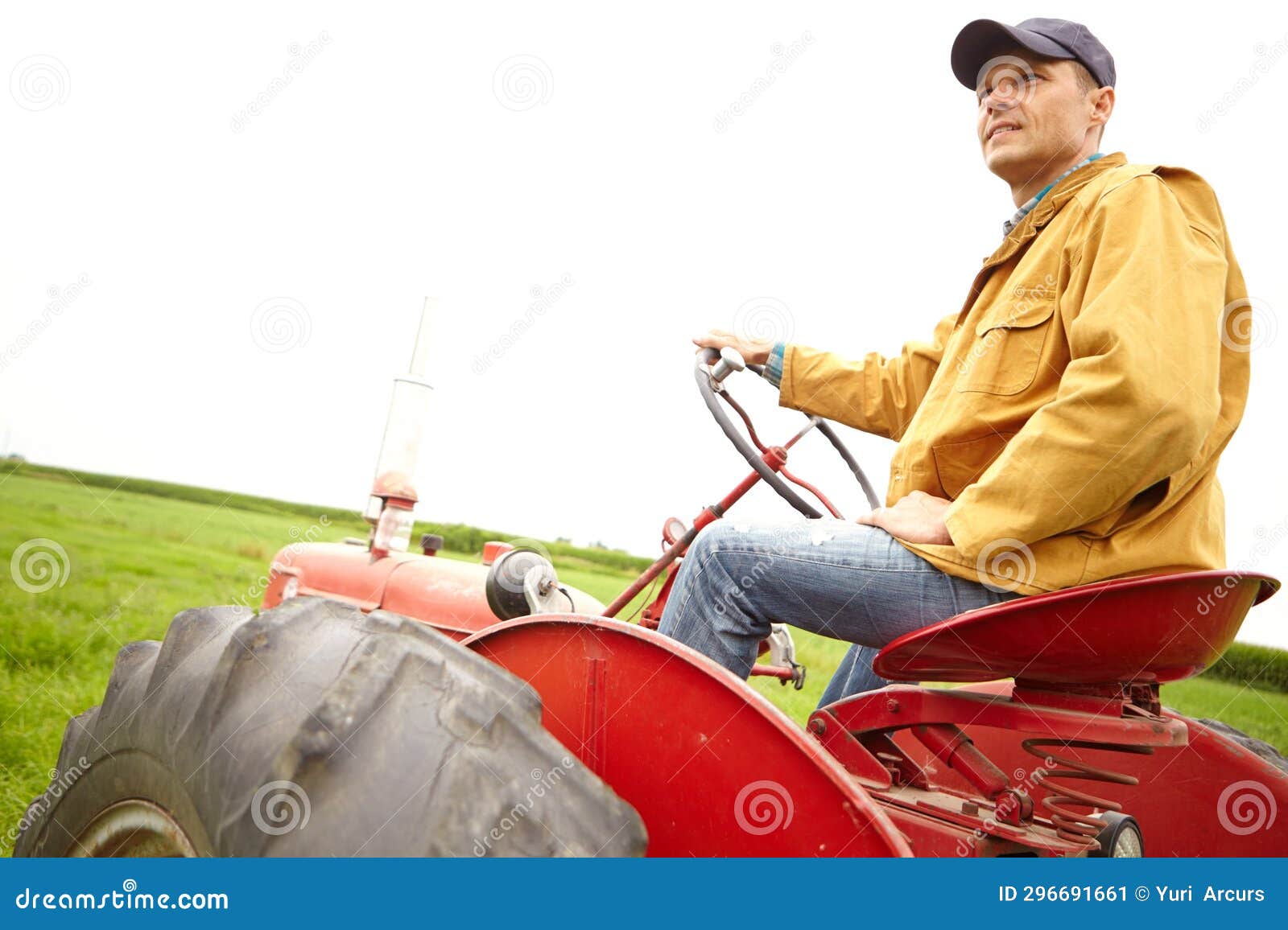 Sitting in Contemplation. a Farmer Sitting on His Tractor and Looking ...