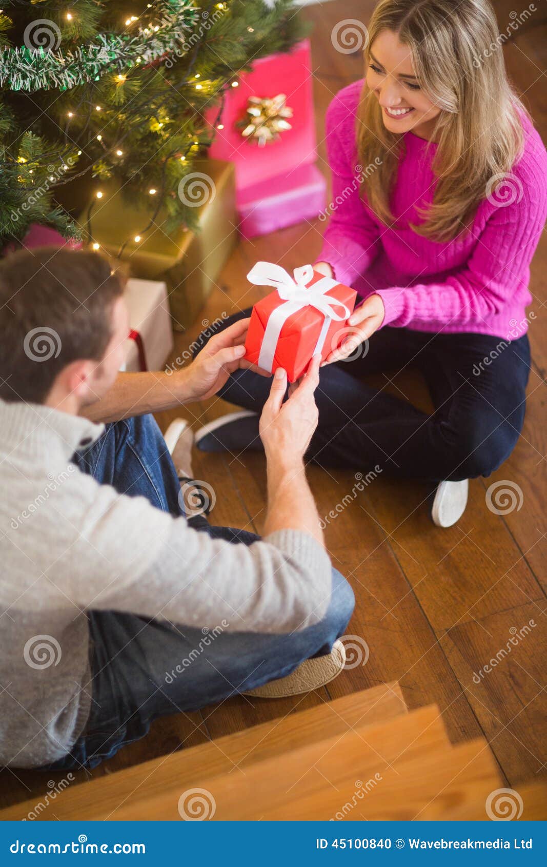 Sitting Couple Giving Each Other Presents Stock Photo - Image of angle ...
