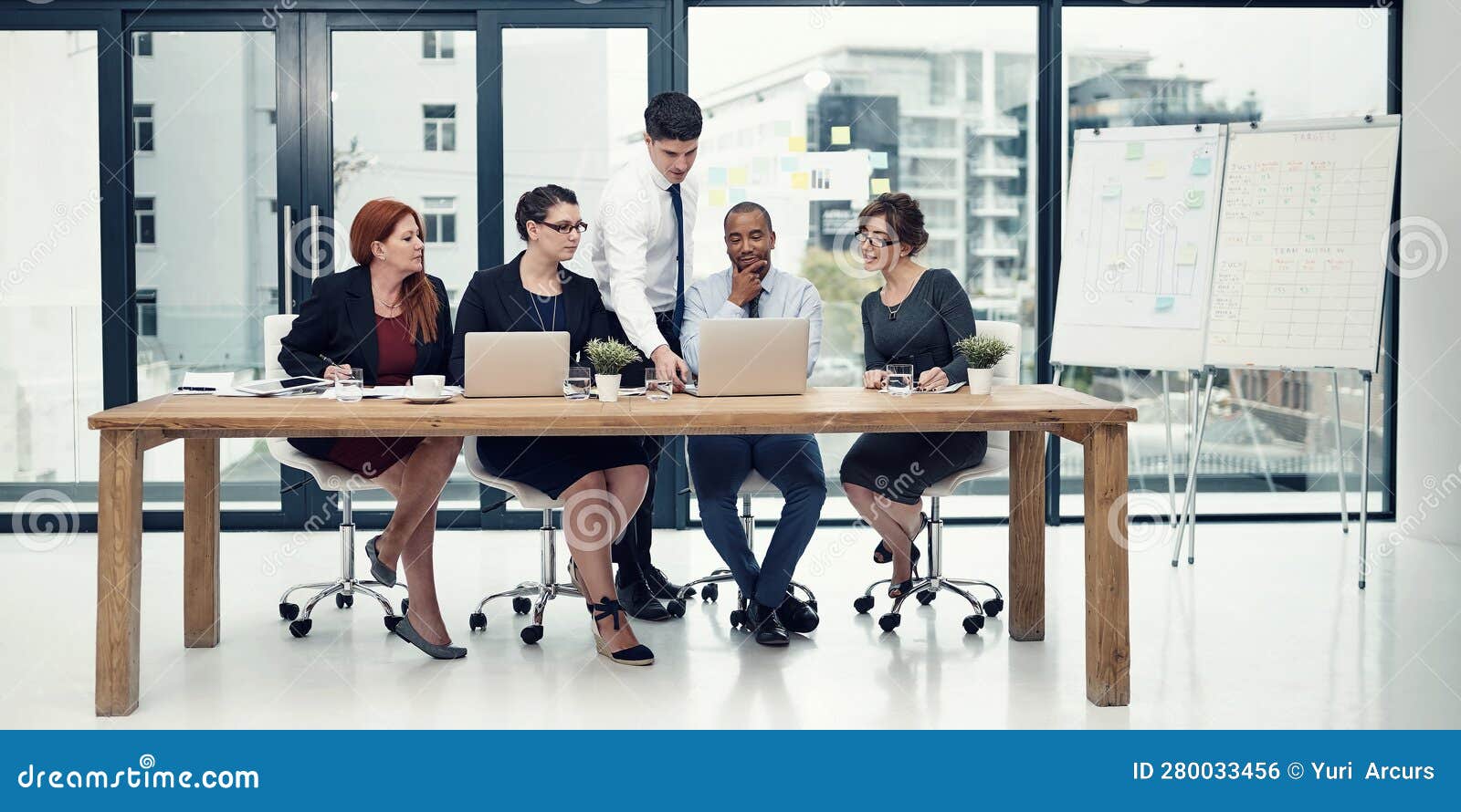 Sitting Down with Their Problem-solving Tools. Group of Businesspeople ...