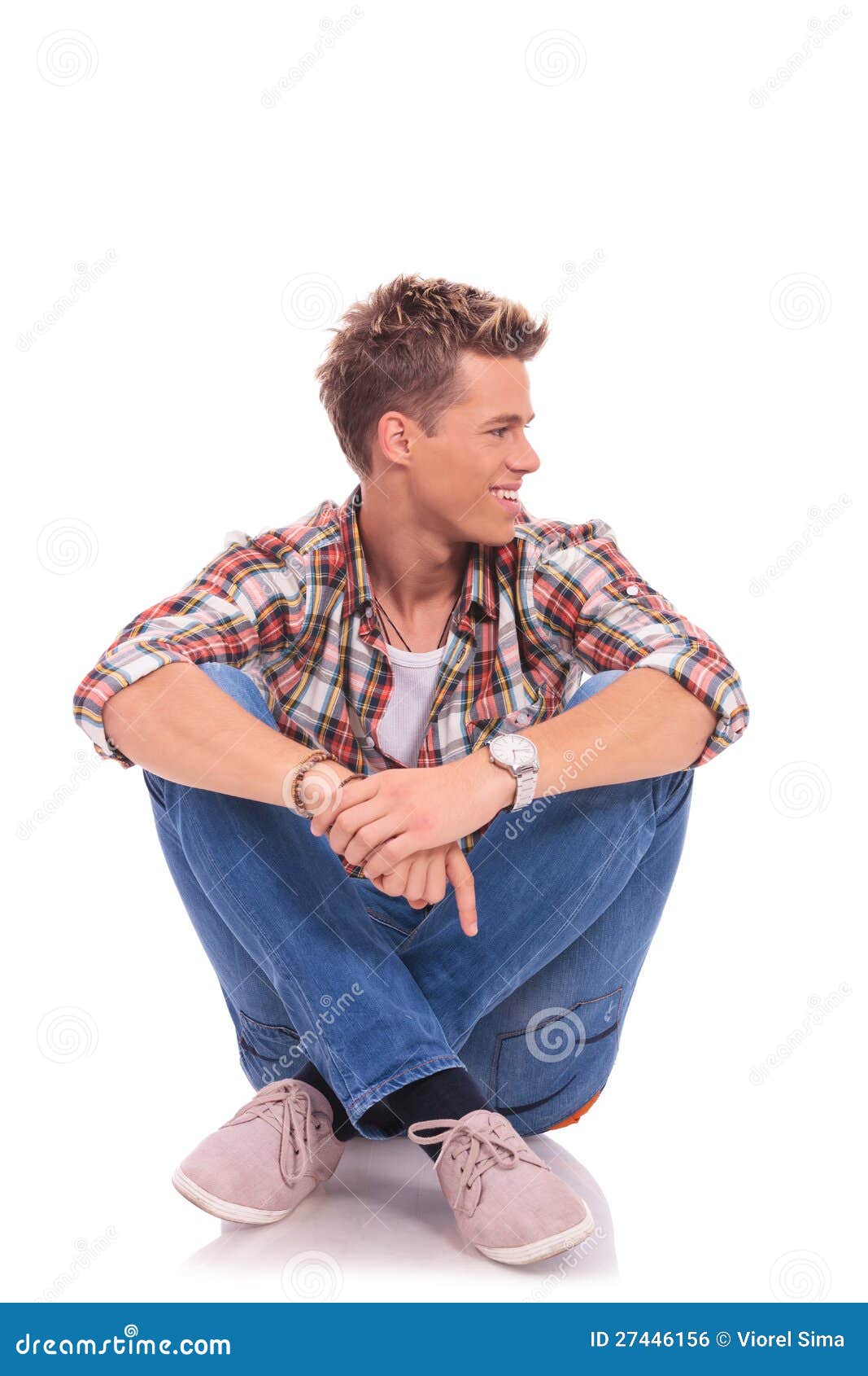 Sitting man is smiling stock photo. Image of people, jeans - 27446156