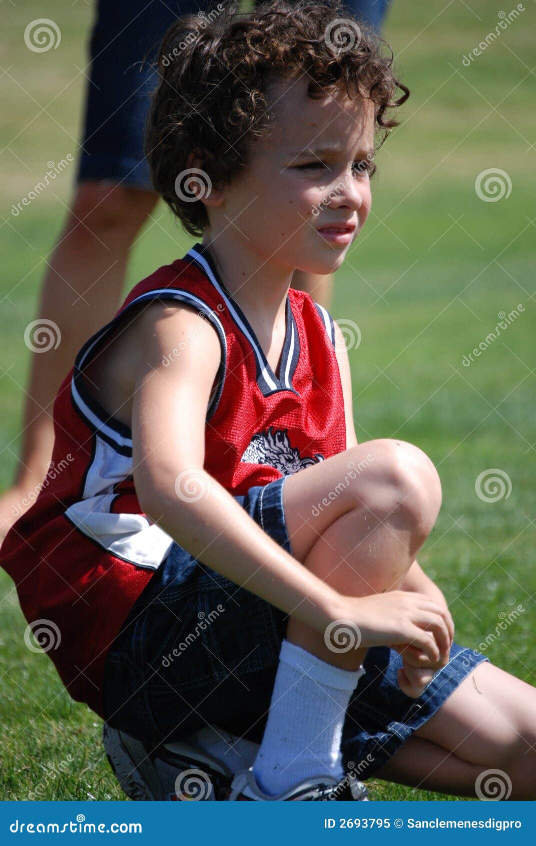 Sitting it out stock image. Image of face, field, kneeling - 2693795