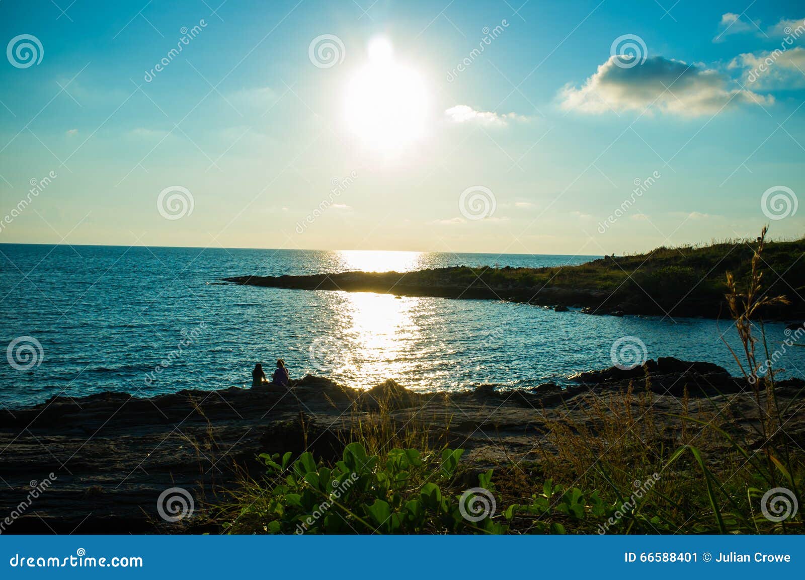 Sitting on the Rocks with Sun Going Down Stock Image - Image of julian ...
