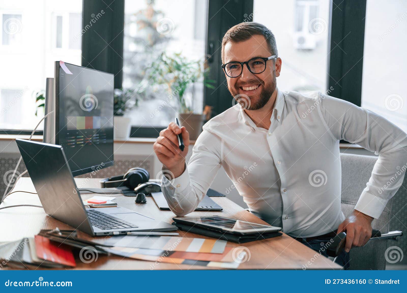Sitting and Smiling. Man in Formal Clothes is Working in the Modern ...