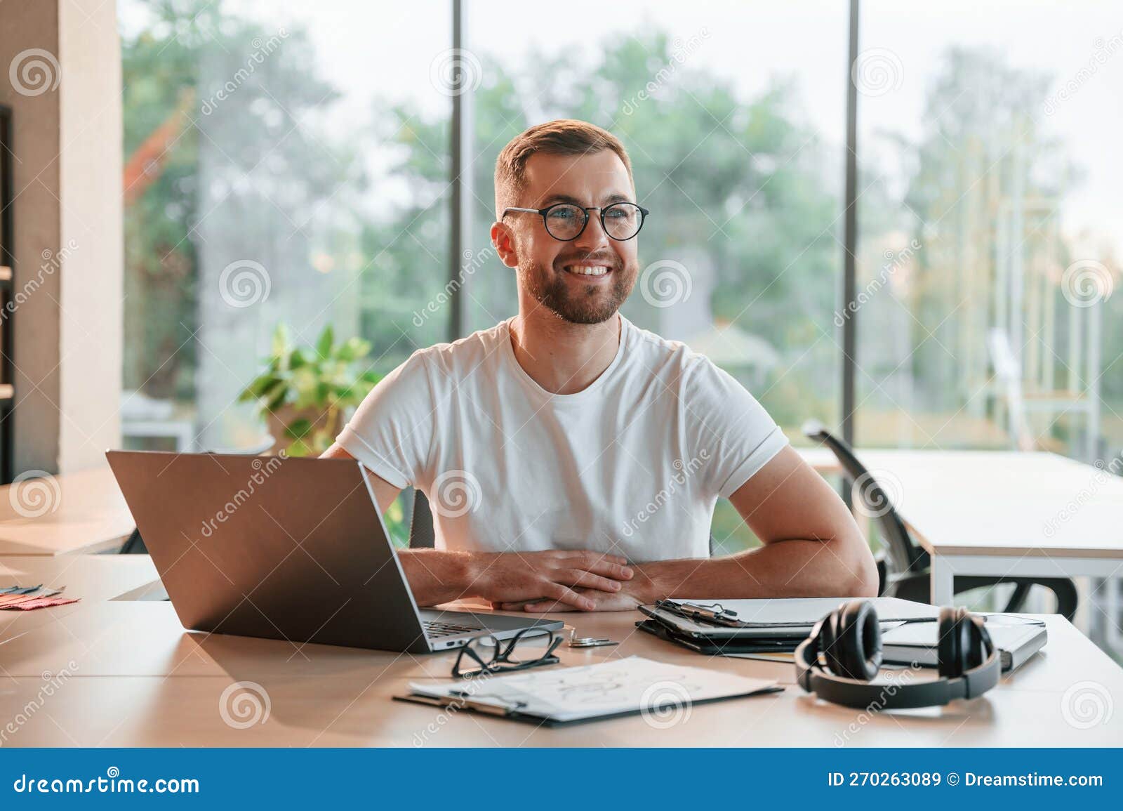 Sitting and Smiling. Positive Man in Formal Clothes is Working in the ...