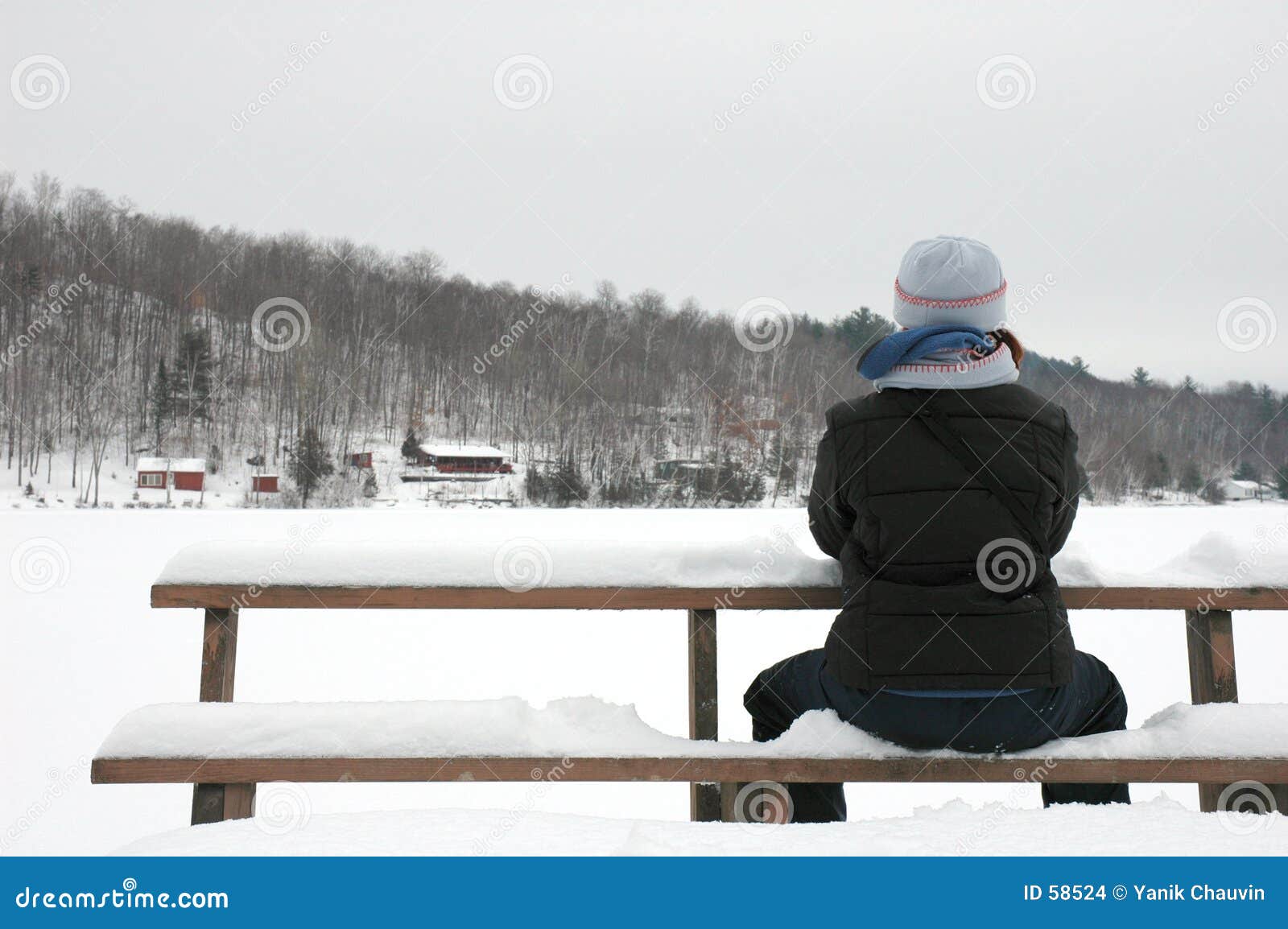 Sitting in the snow stock photo. Image of looking, tuque - 58524
