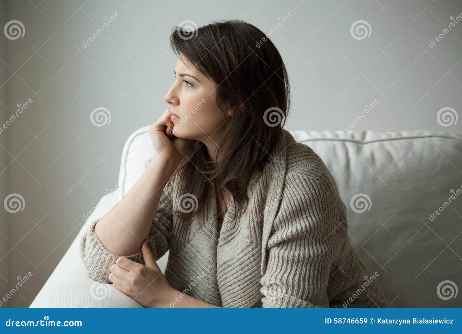 Sitting on the Sofa and Thinking Stock Image - Image of beauty, beige ...