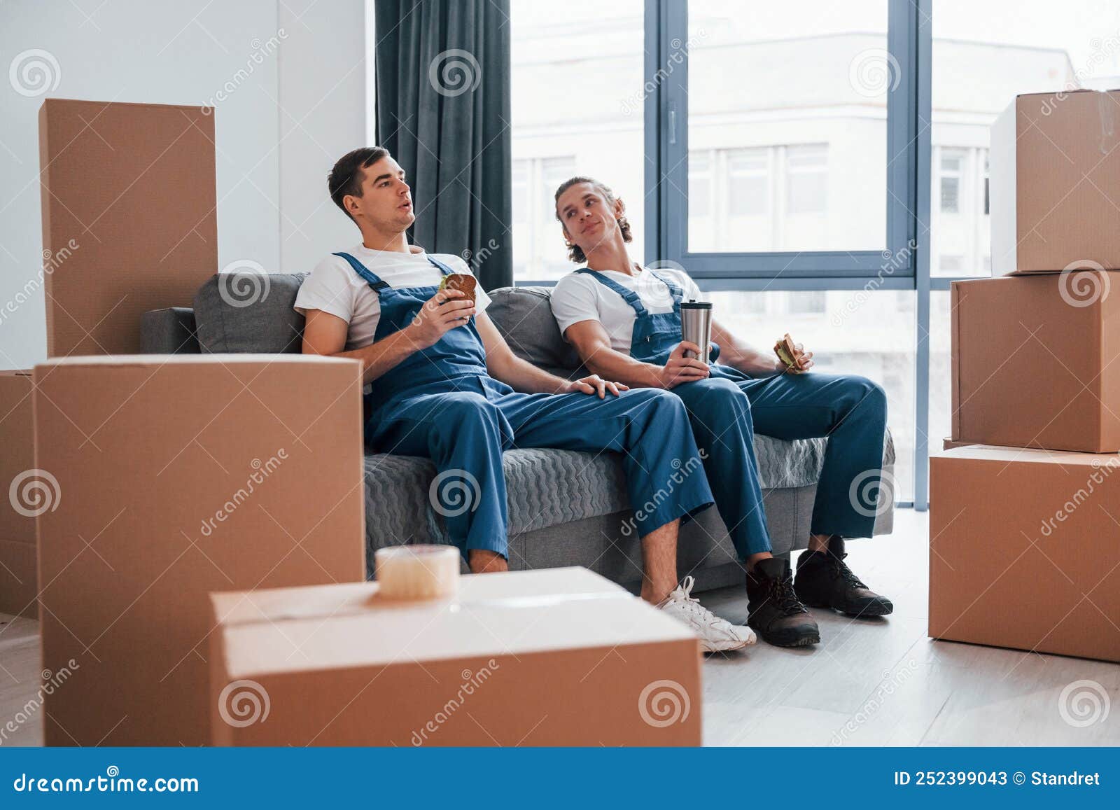 Sitting on the Sofa. Tired and Taking Break Stock Image - Image of ...