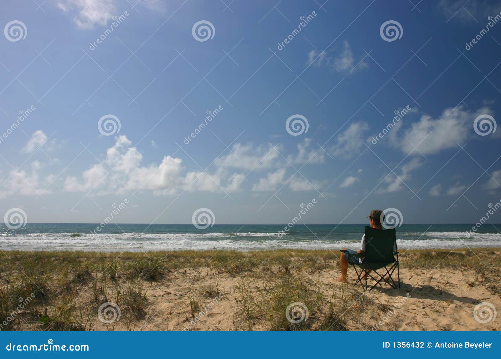 Sitting in the sun stock photo. Image of quiet, seashore - 1356432