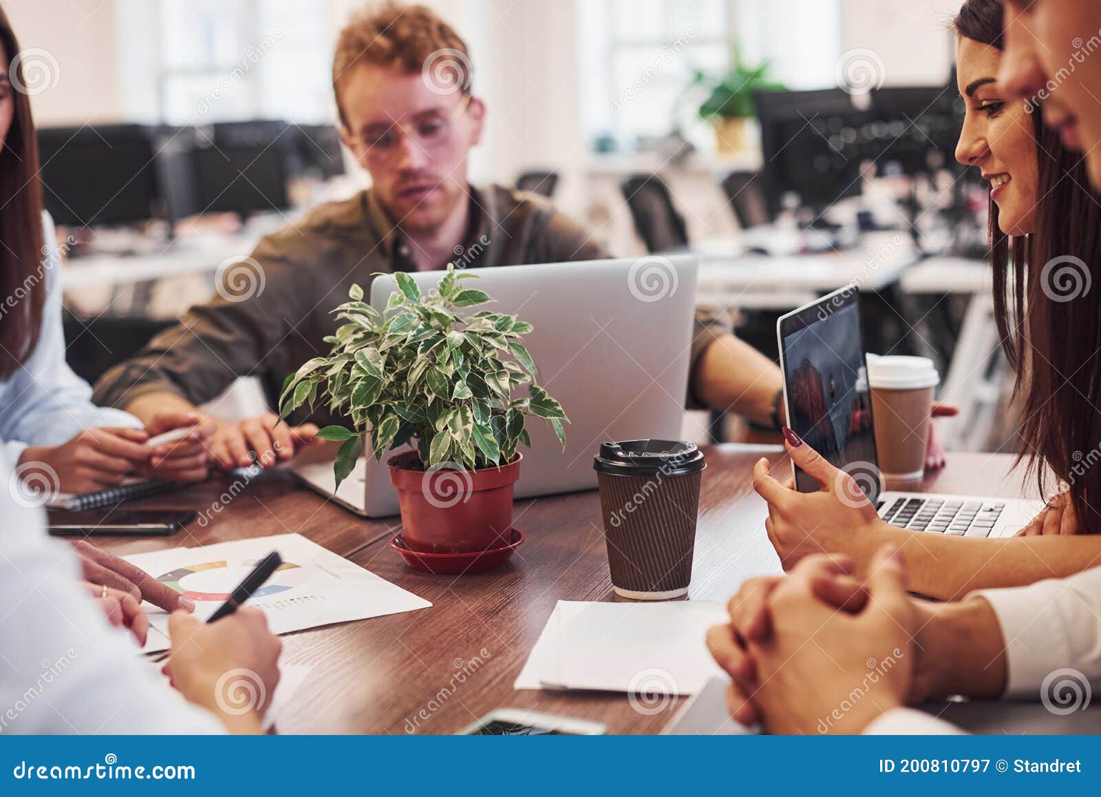 Sitting by the Table. Young Business People Working Together in the ...