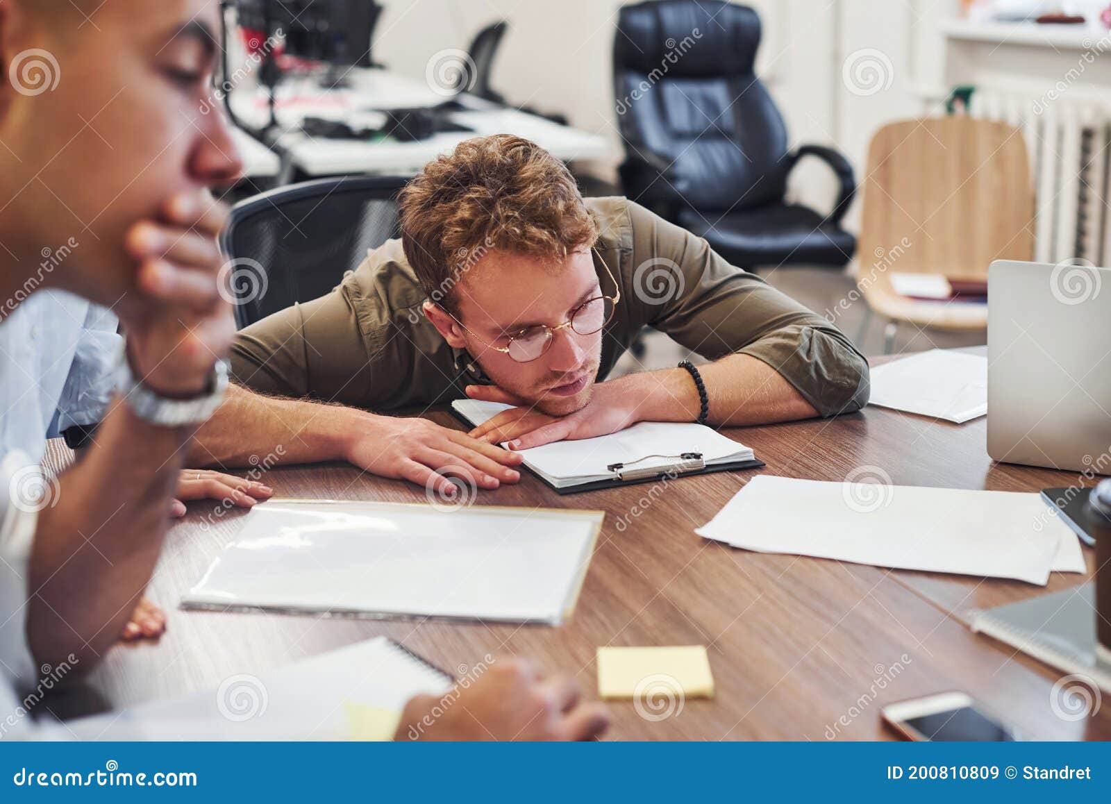 Sitting by the Table. Young Business People Working Together in the ...