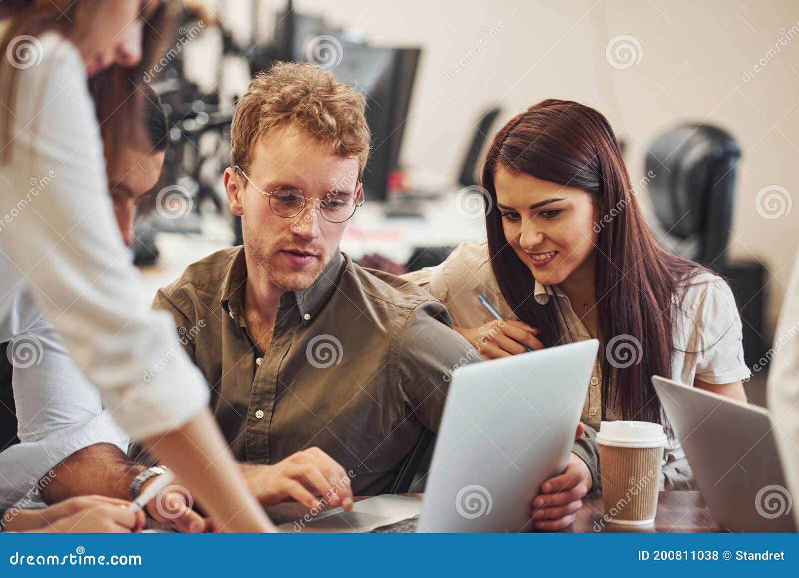 Sitting by the Table. Young Business People Working Together in the ...