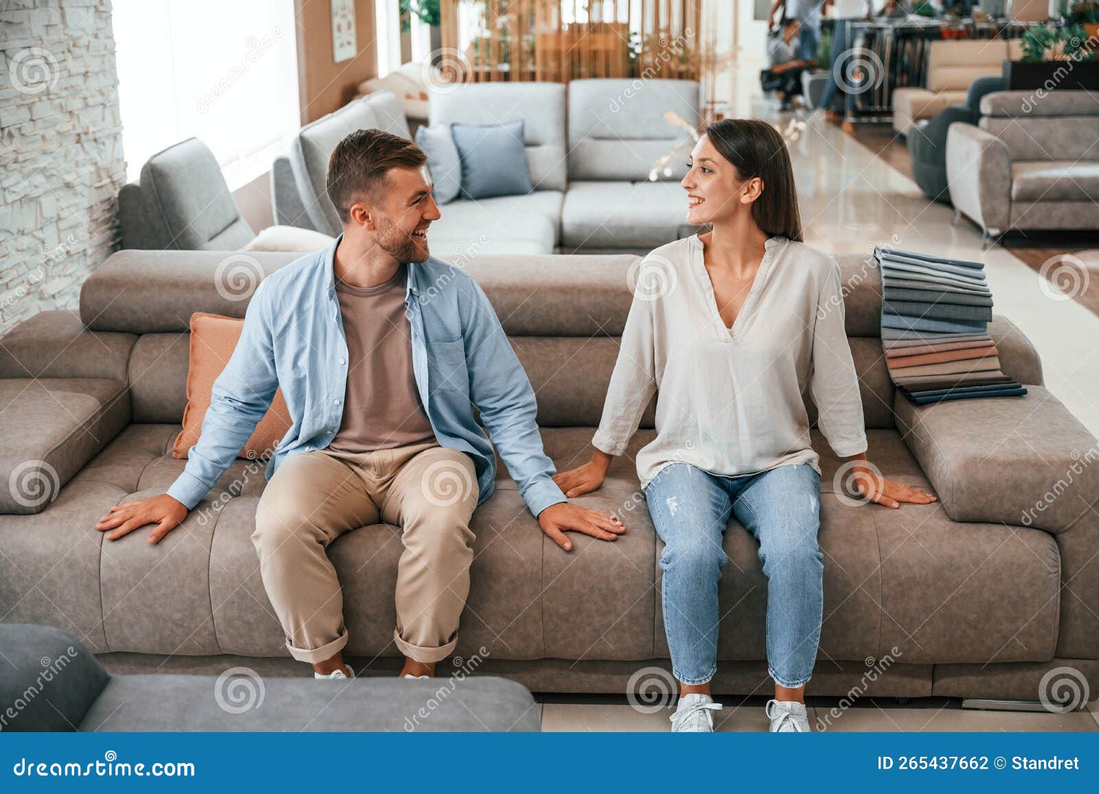 Sitting and Testing Product. Couple Choosing the Sofa and Bed in the ...
