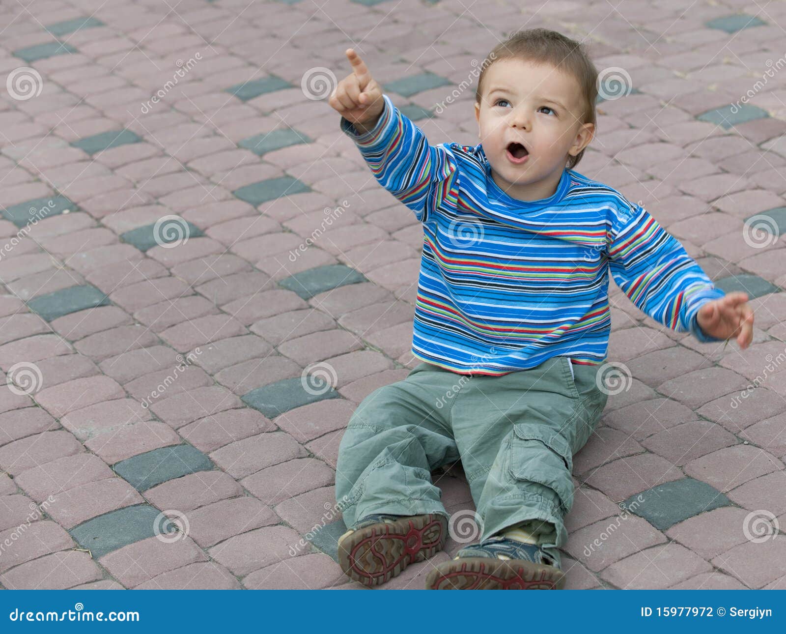 Sitting Toddler is Showing a Plain Stock Photo - Image of close, little ...