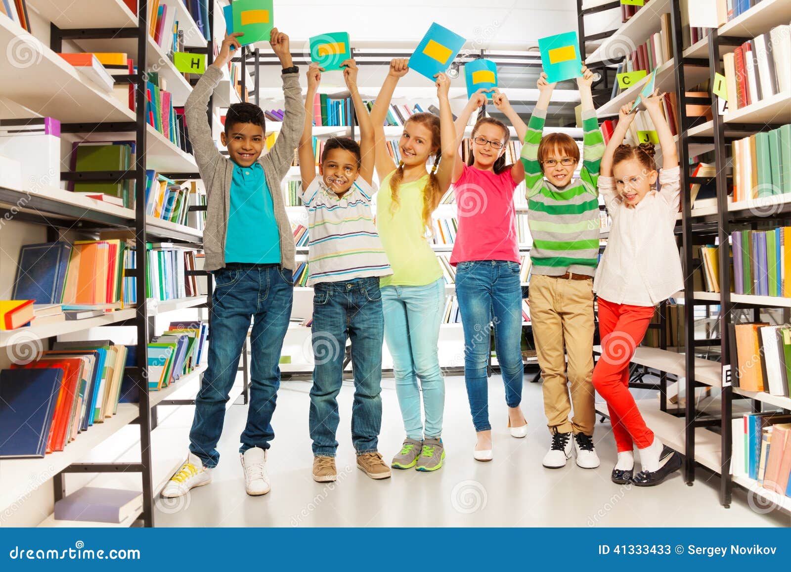 Six Children with Hands Up Hold Exercise Books Stock Image - Image of ...