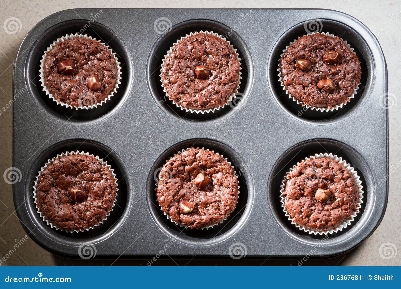 Six chocolate muffins stock image. Image of hazelnut - 23676811