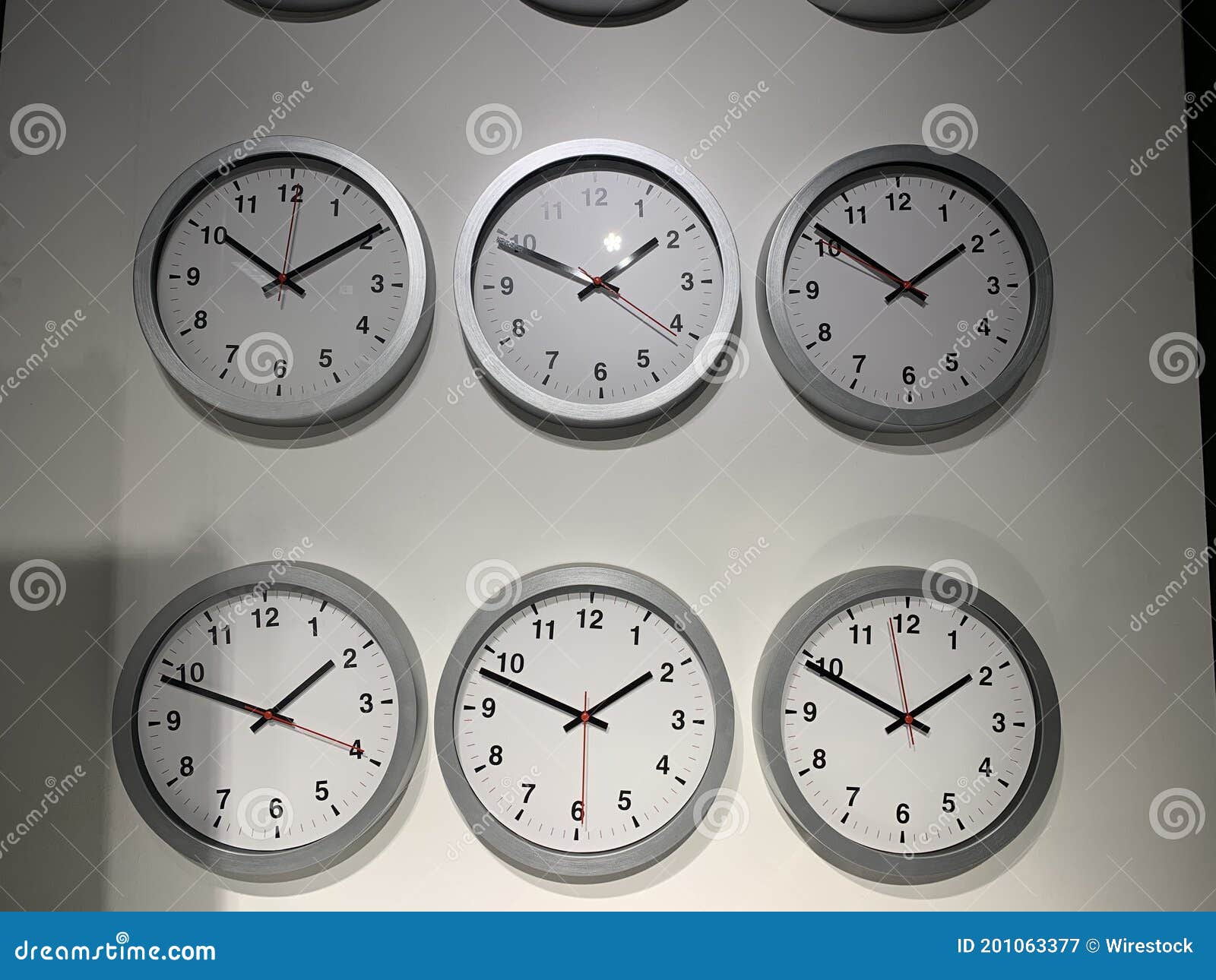 Six Clocks on a White Indoor Wall Stock Image - Image of decoration ...