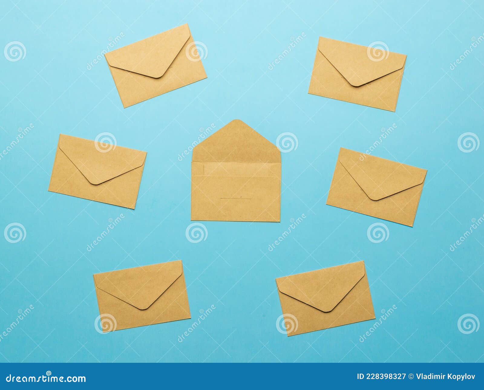 Six Closed and One Open Postal Envelopes on a Blue Background. Flat Lay ...