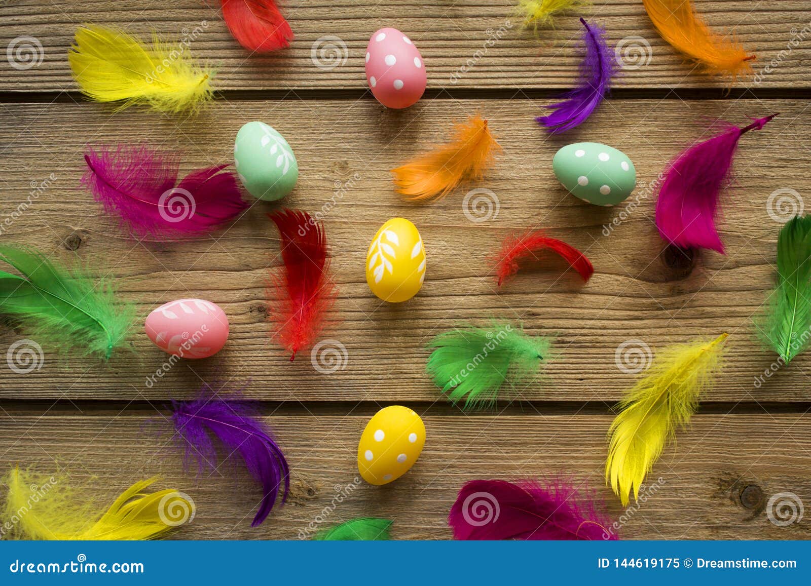 Easter Eggs with Feathers on Wooden Table Stock Image - Image of orange ...