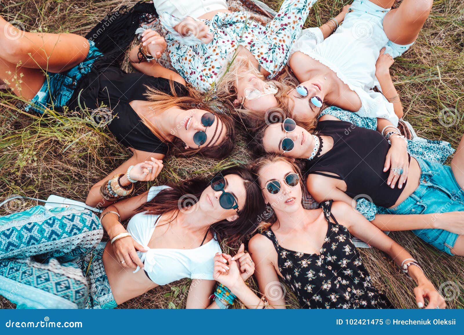 Six girls lie on the grass stock image. Image of hair - 102421475