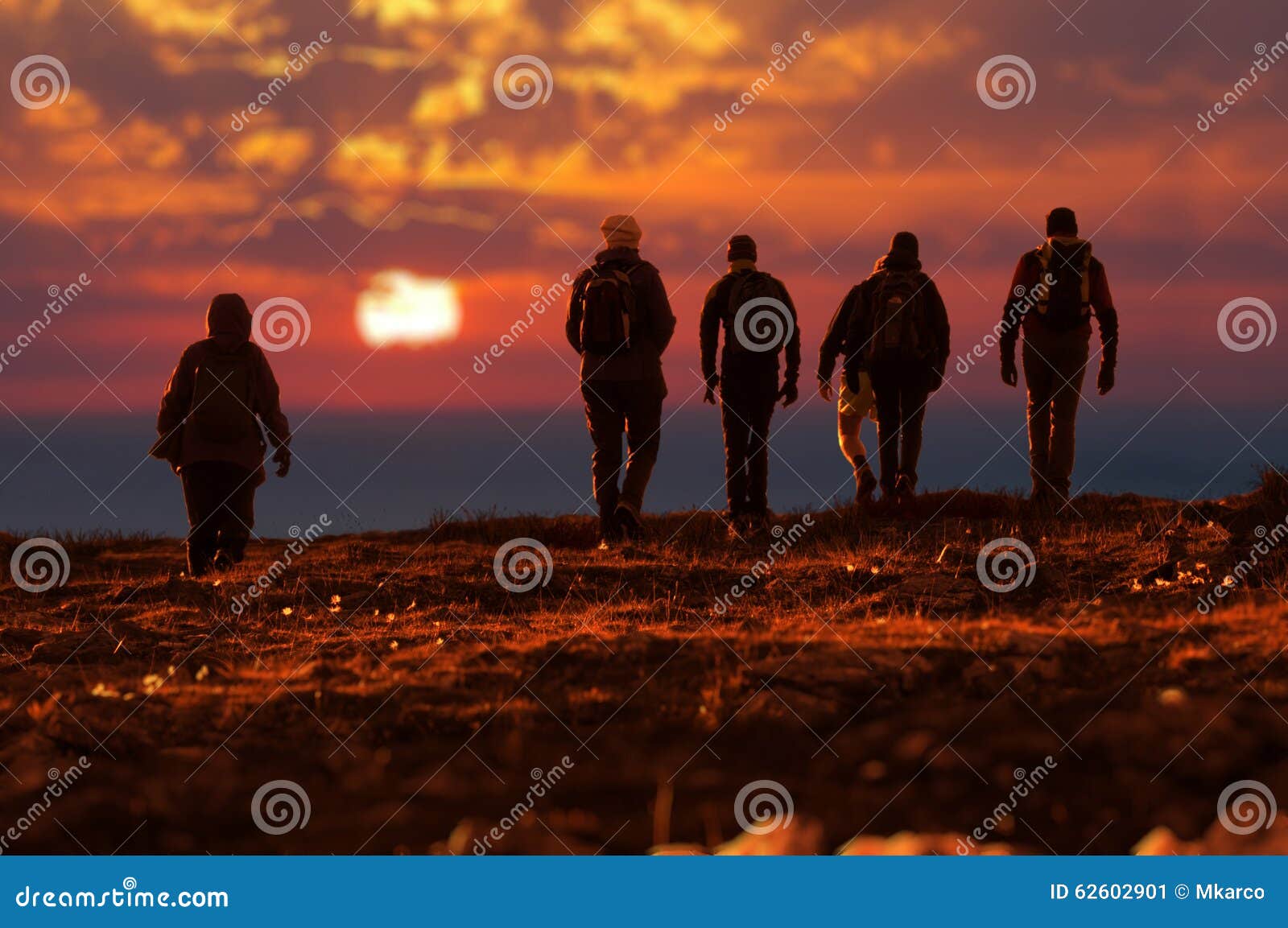Six Hikers Walking at Sunset Stock Image - Image of looking, survival ...