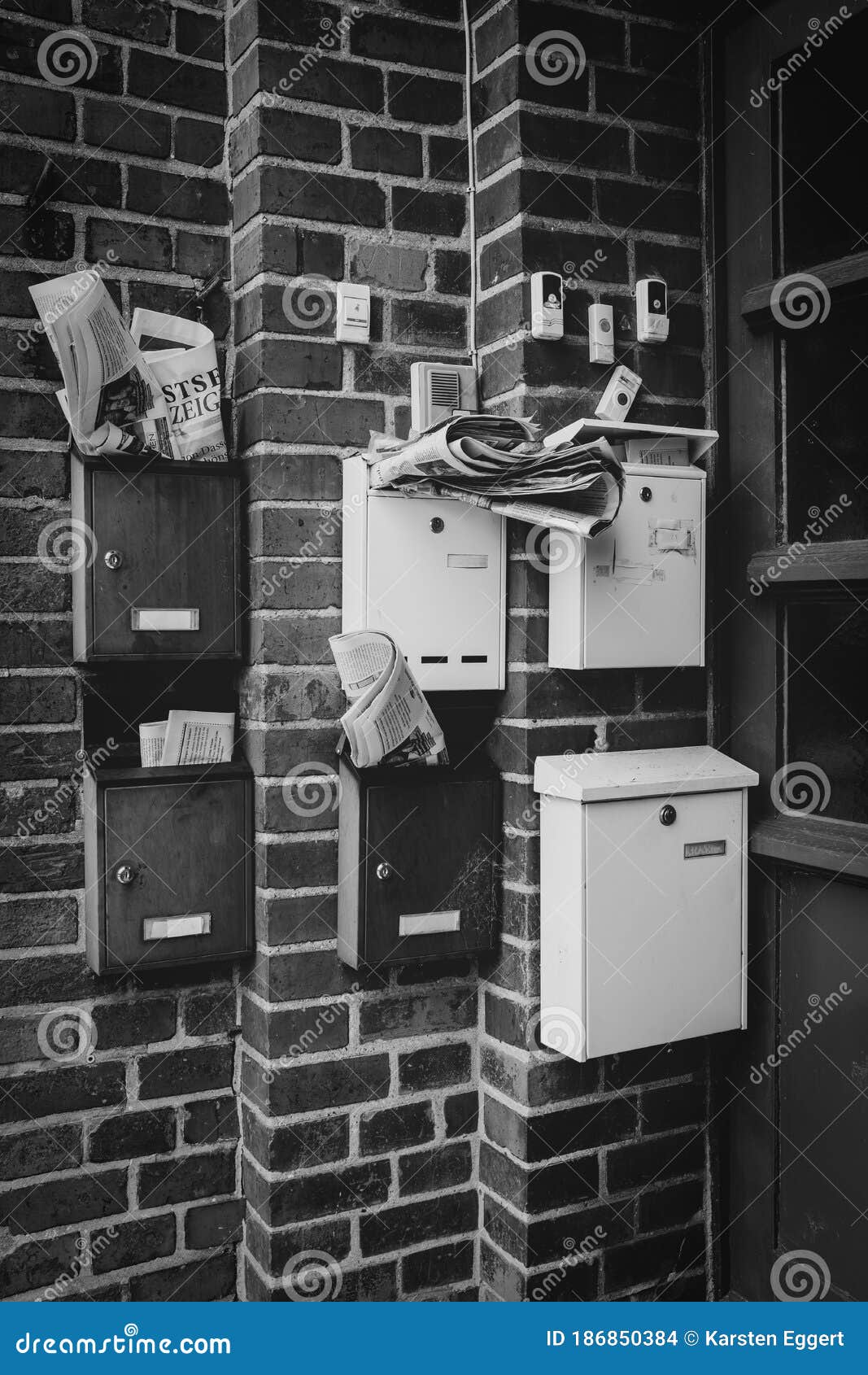 6 Overcrowded Mailboxes are Hanging in a Doorway Stock Photo - Image of ...