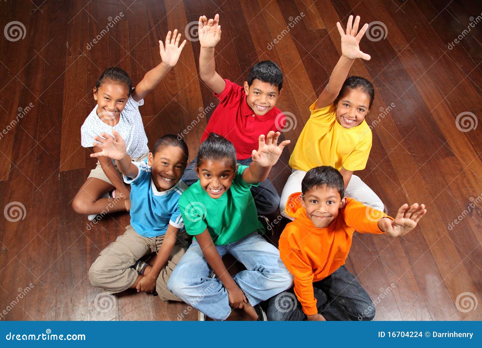 Six School Children Sitting in Classroom Hands Up Stock Photo - Image ...