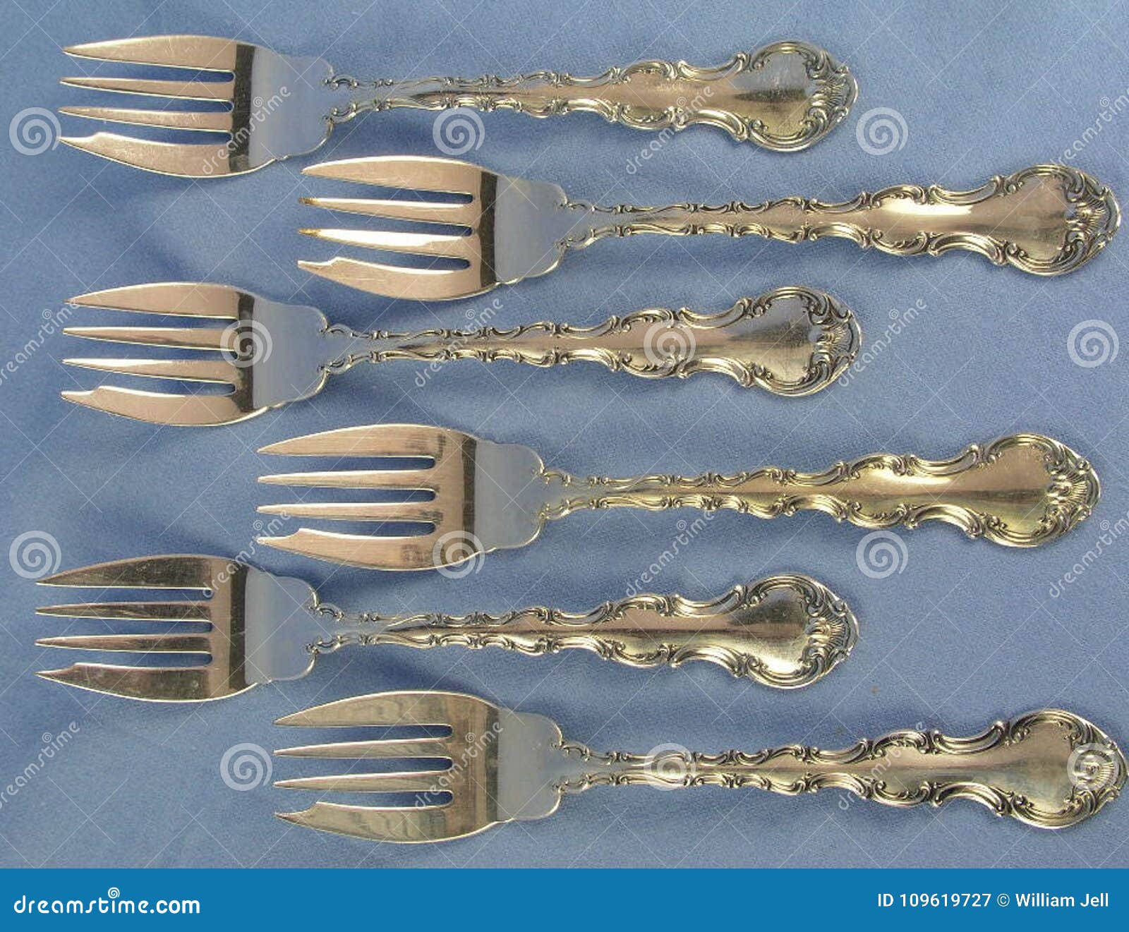 Six Silver Forks in a Row stock image. Image of vintage - 109619727