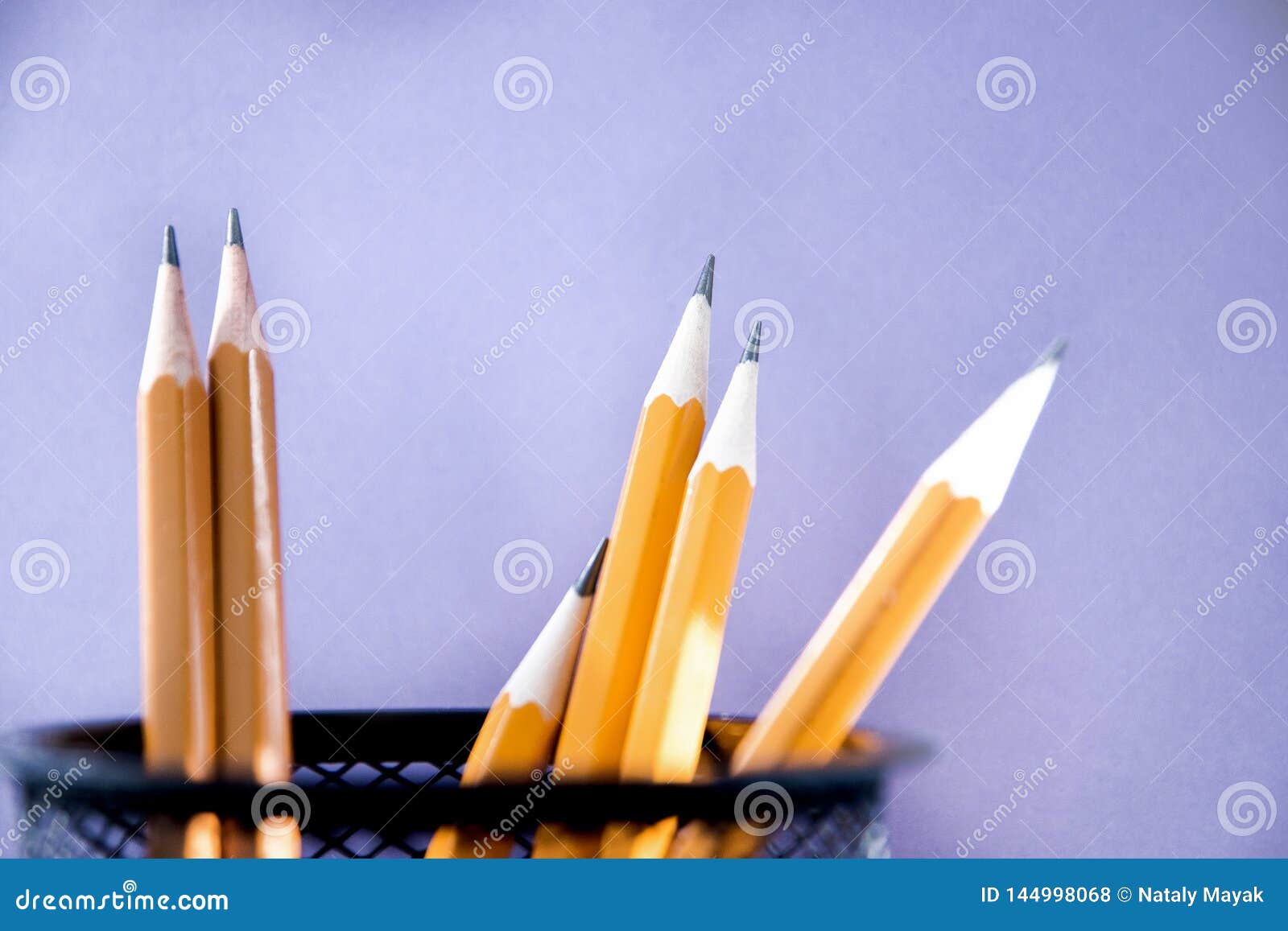 Six Simple Pencils Purple Background with Copy Space. Selective Focus ...