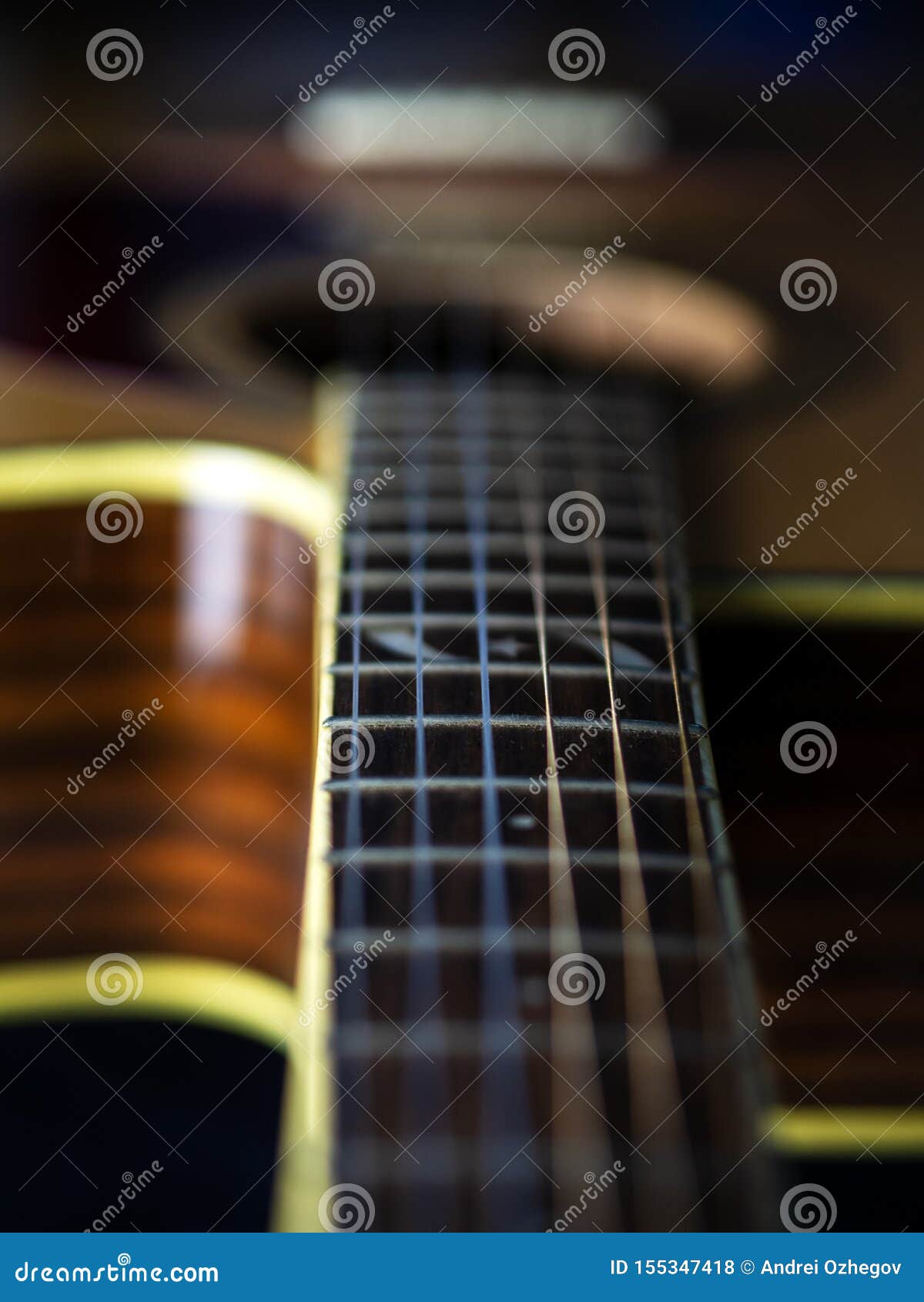 Six - String Acoustic Guitar on a Black Background. Low Key Stock Photo ...