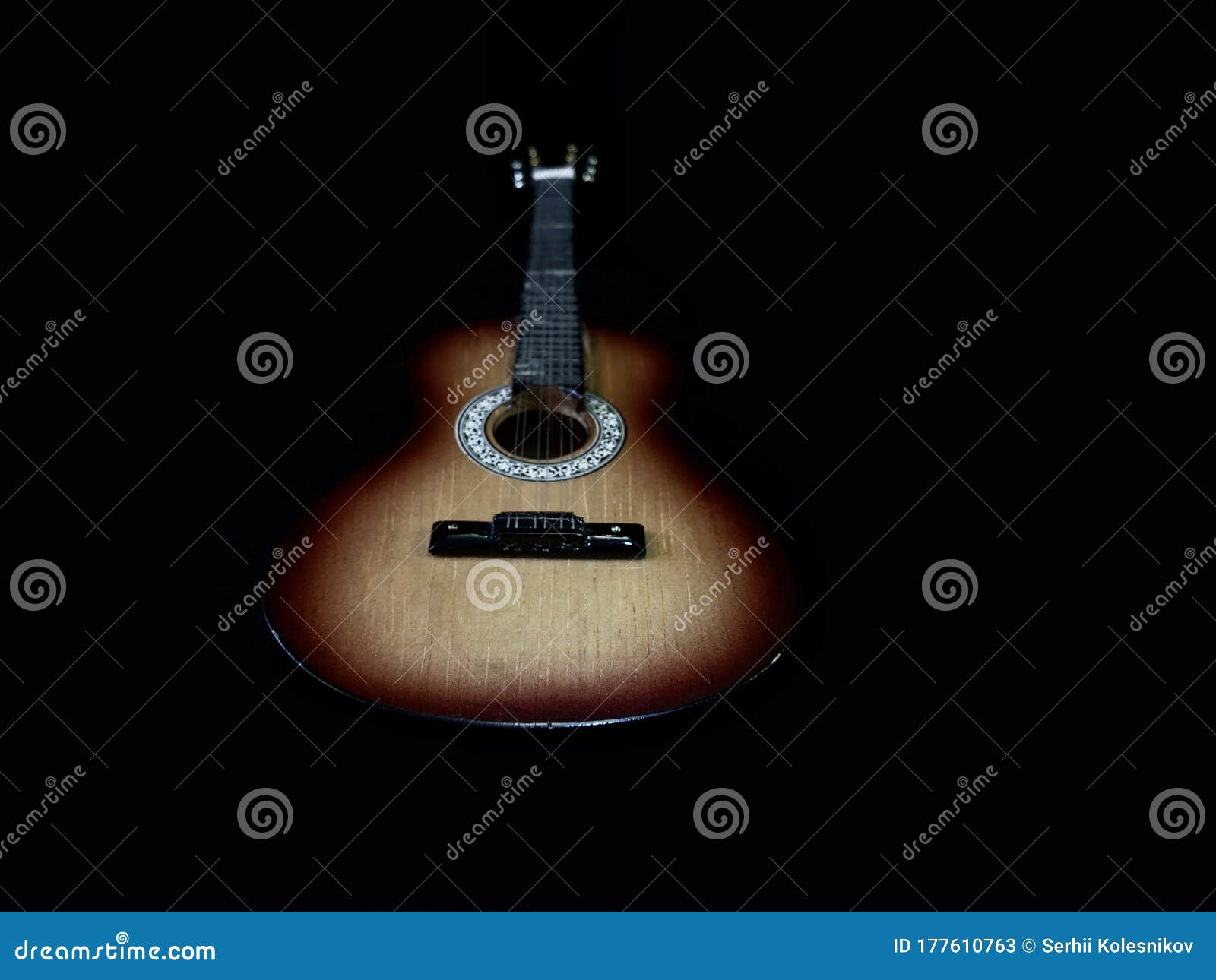 Six-stringed Acoustic Guitar on a Black Background. Musical String ...