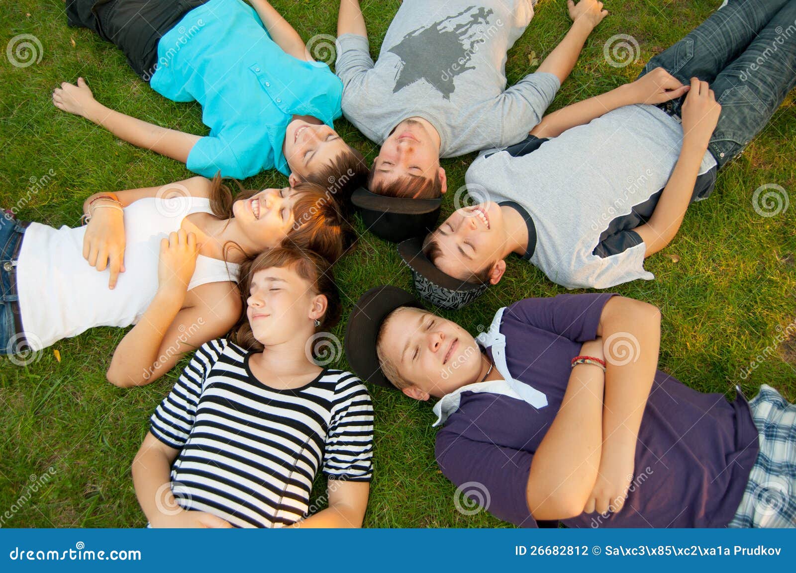 Six Teenage Friends Lying on the Grass Stock Photo - Image of girls ...