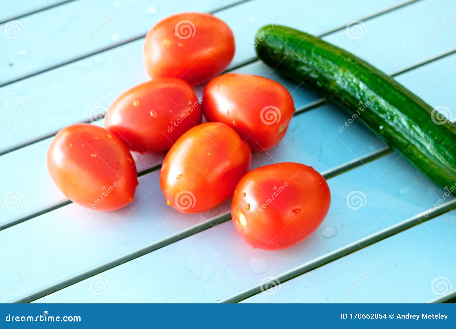 Six Tomatoes on the Table and One Cucumber Salad Stock Photo - Image of ...