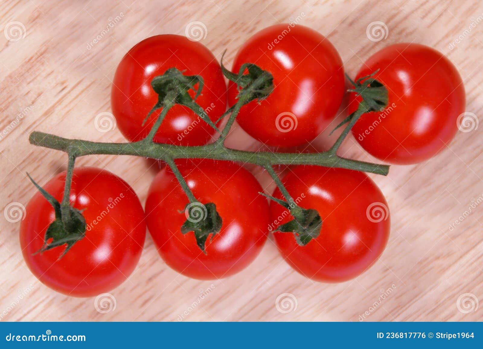 Six Tomatoes on the Vine on a Wood Chopping Board Stock Photo - Image ...
