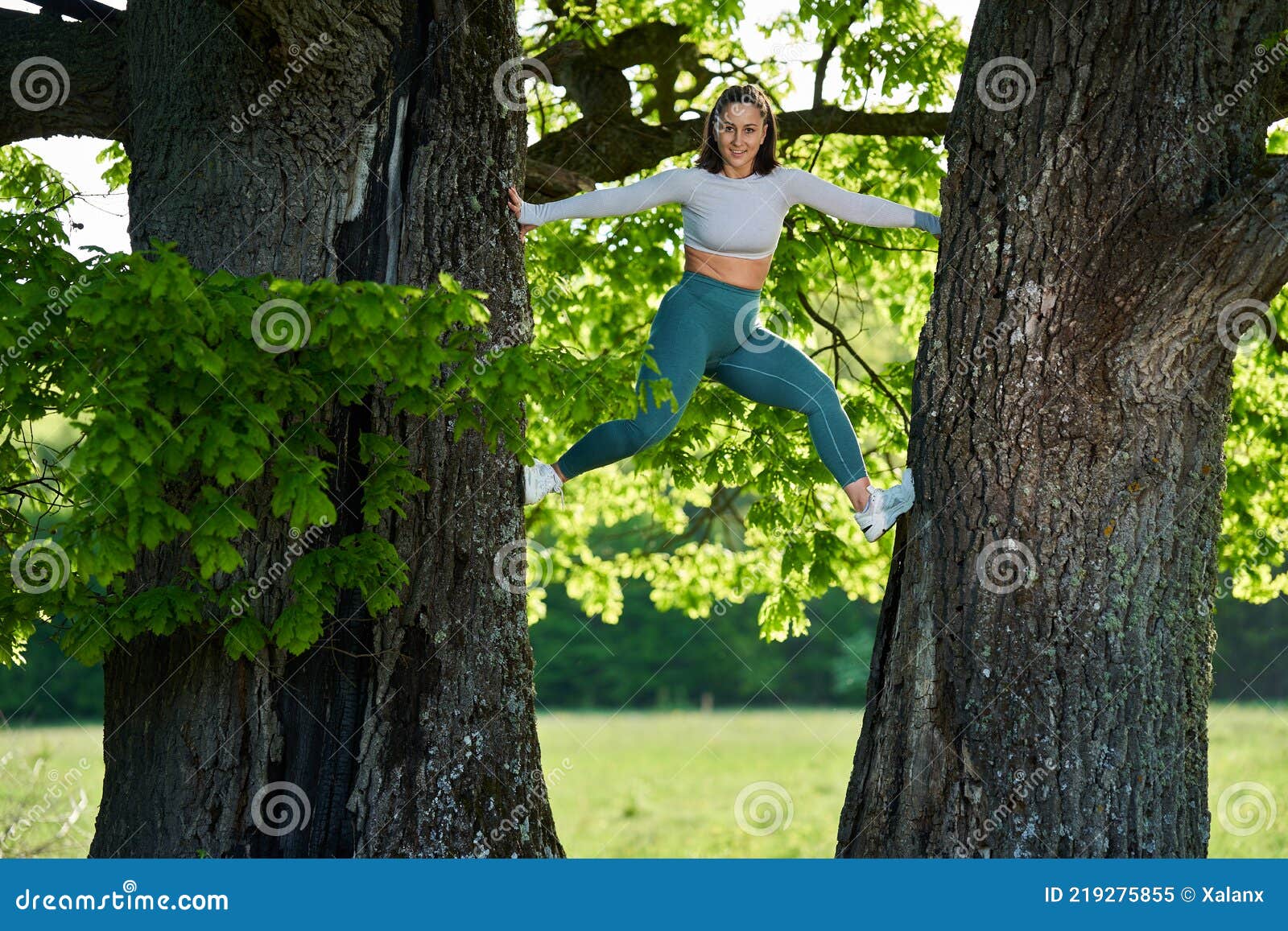 Plus Size Young Woman Climbing in a Tree Stock Image - Image of ...