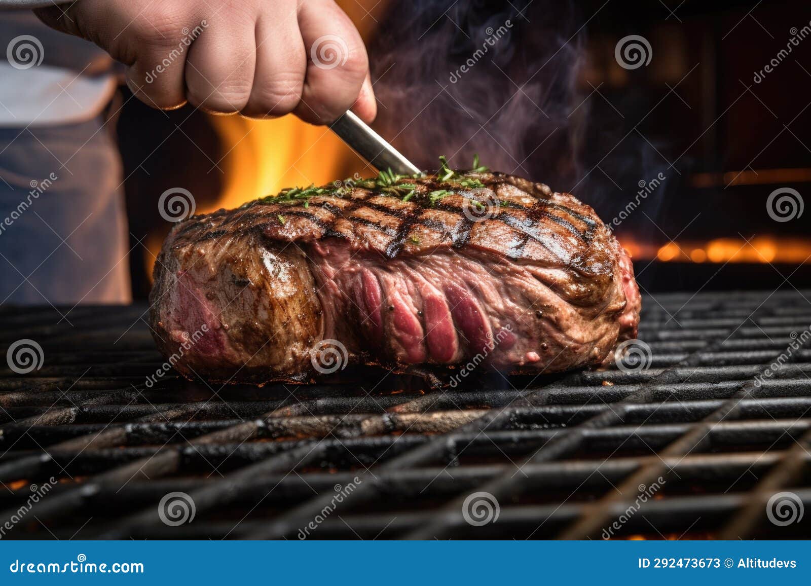 Sizzle of a Thick-cut Steak As Hand Sets it on Grill Stock Image ...