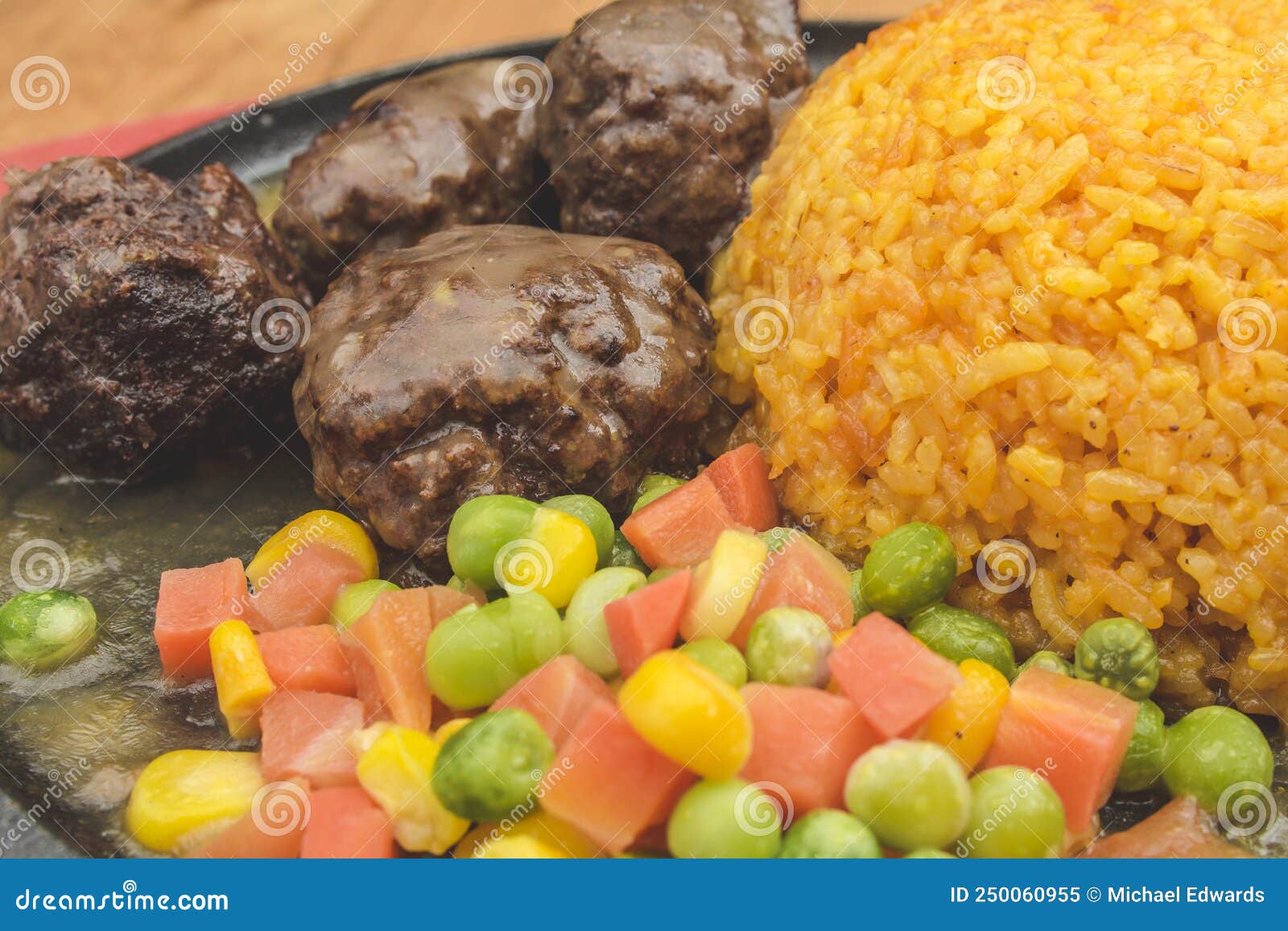 Sizzling Beef Meatballs Served with Mixed Vegetables and Java Rice on a ...