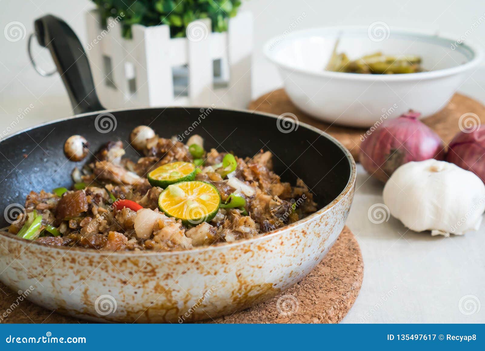 Sizzling Pork Sisig With Raw Egg Royalty-Free Stock Photography ...