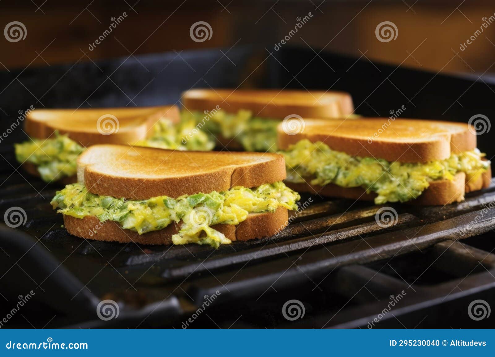 Sizzling Sandwich on Griddle, Squashed by Cast Iron Press Stock Photo ...