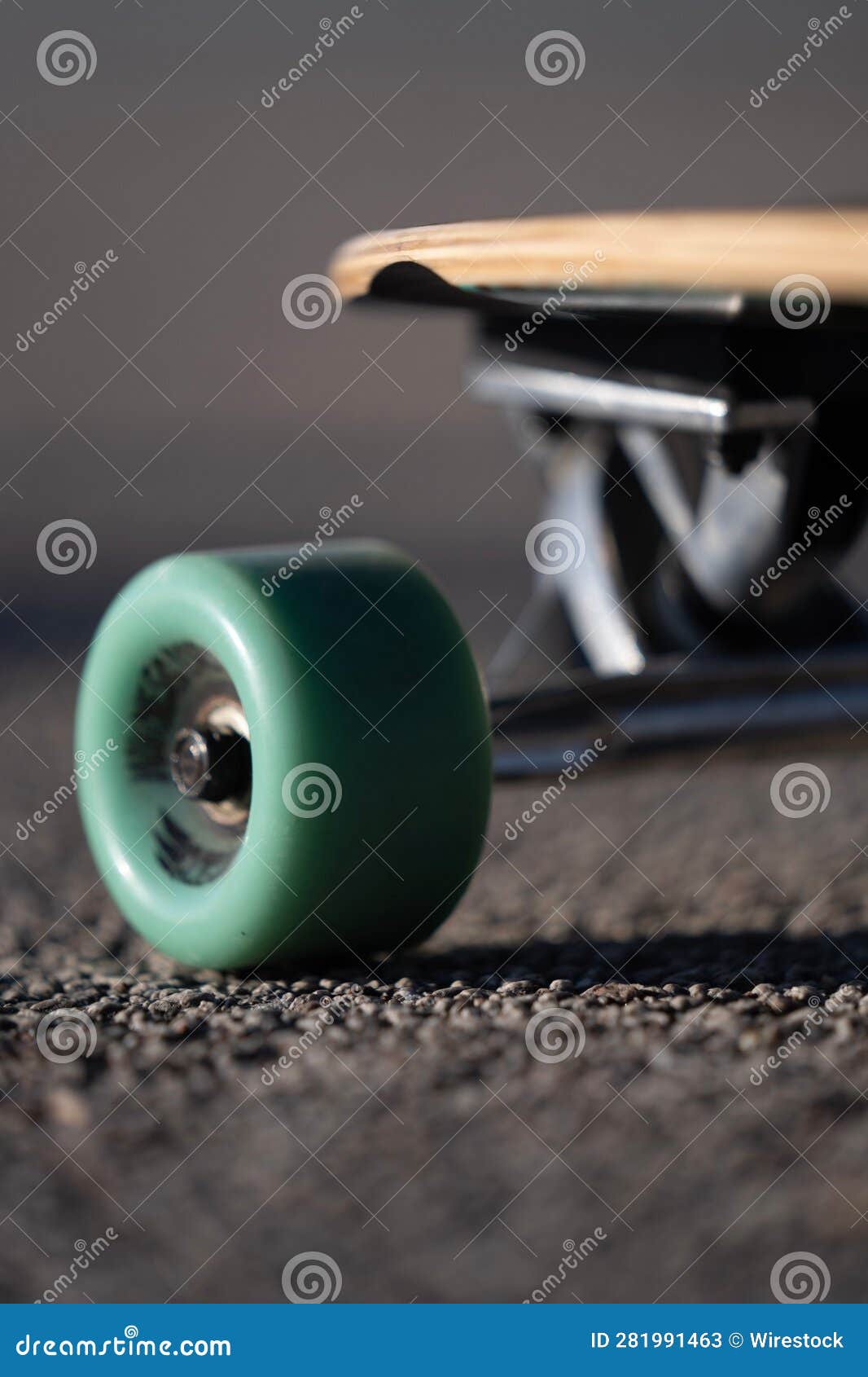 Skateboard Sitting in the Pavement with Its Wheels Off and Top Half ...
